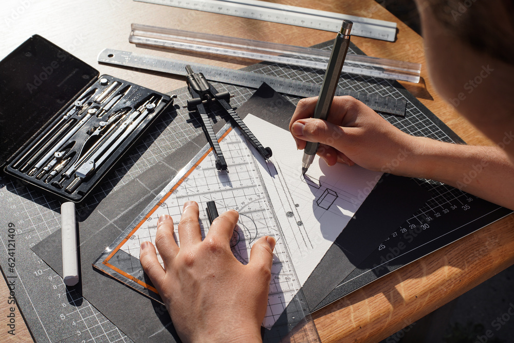 Architect and designer working accurately on a project drawing sketches ...