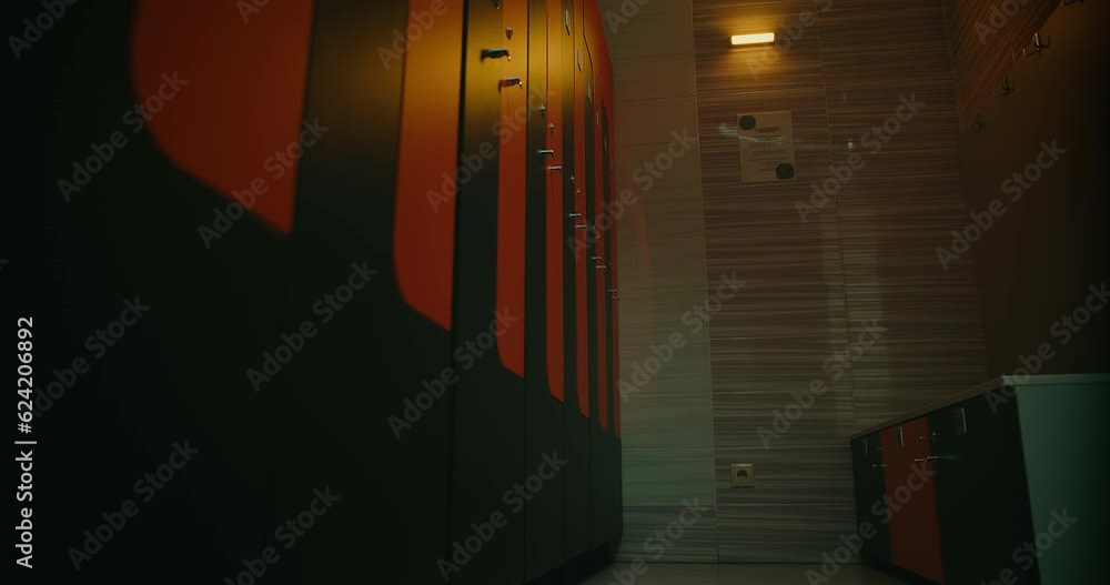 professional female athlete changing clothes in locker room before ...