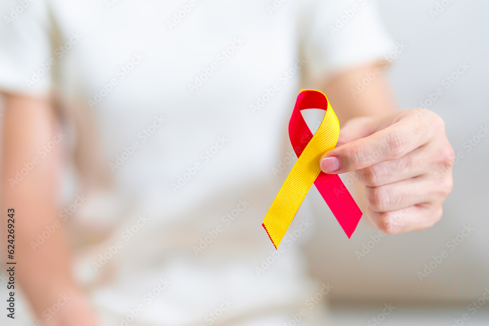 woman holding Red and Yellow ribbon. World hepatitis day awareness ...