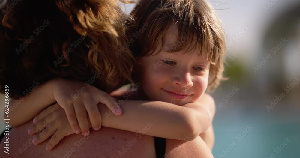 Close up happy little child hugging mom under scorching summer hot sun ...