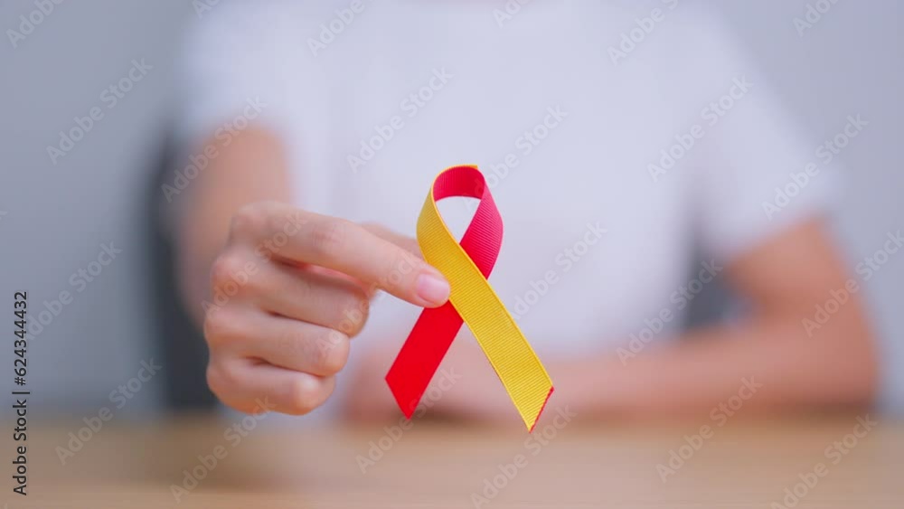 woman holding Red and Yellow ribbon. World hepatitis day awareness ...