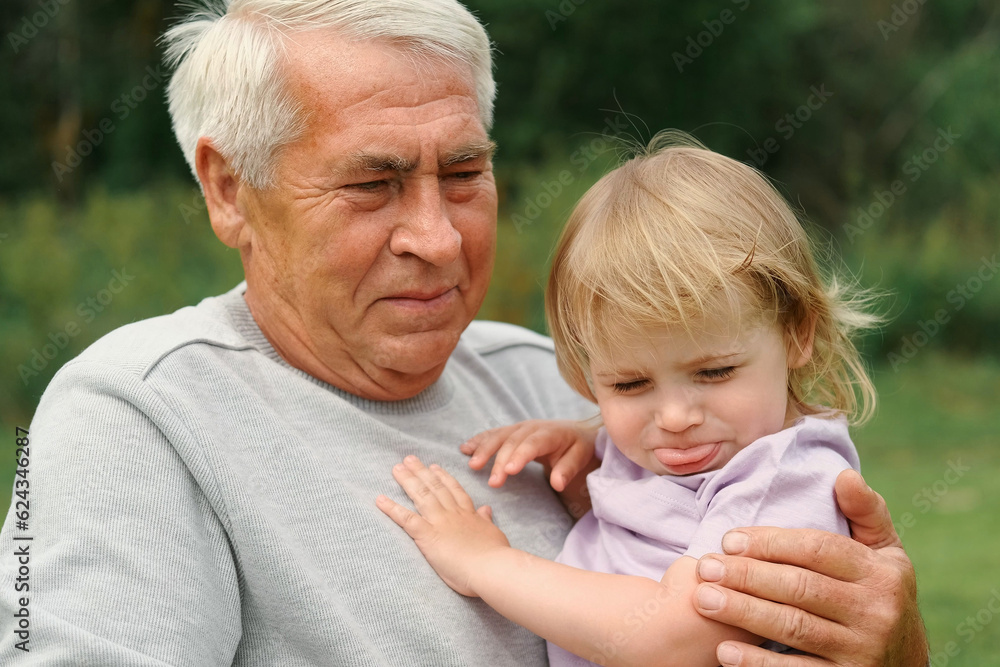 Grandfather and grandchild baby have fun during walk In Park. Happy ...