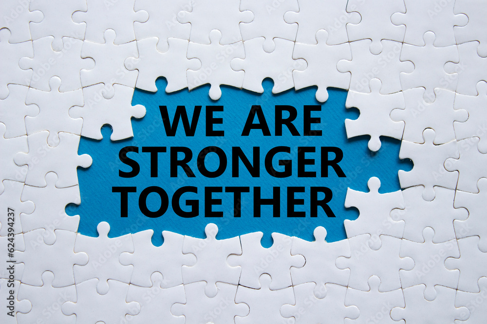 We are stronger together symbol. White puzzle with words We are ...