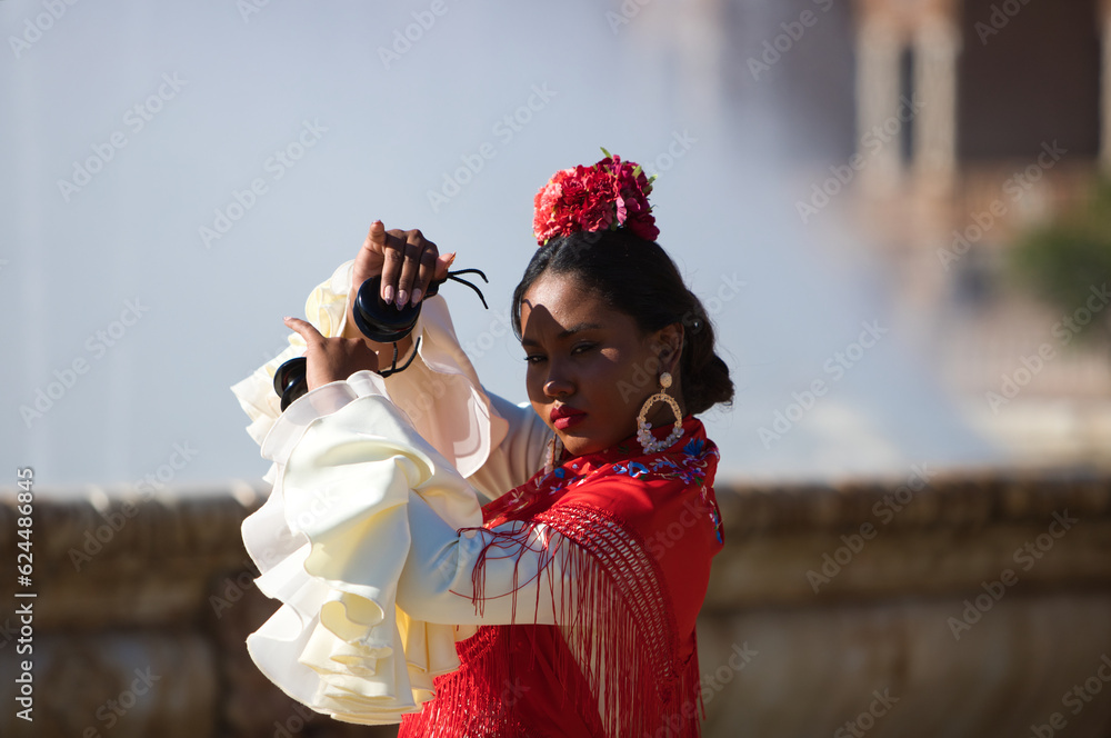 Young black woman dressed as a flamenco gypsy in a famous square in ...