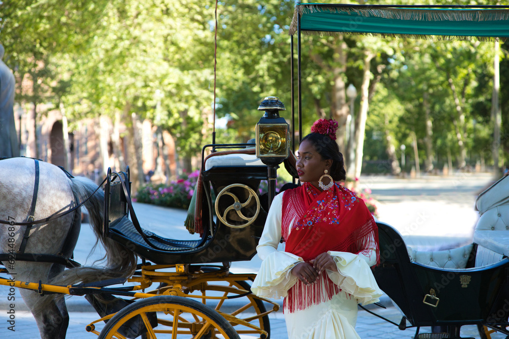 Young black woman dressed as a flamenco gypsy in a famous square in ...