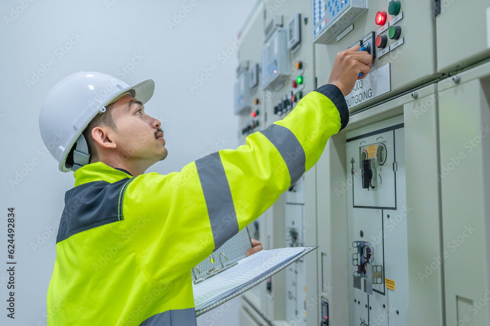 Electrical engineer man checking voltage at the Power Distribution ...