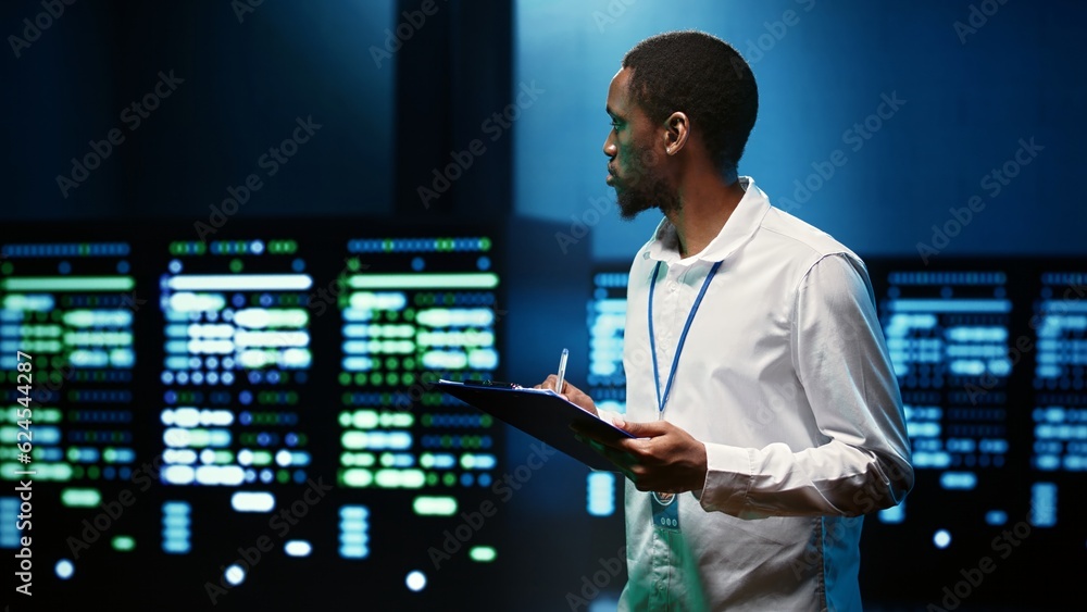System administrator analysing server clusters performing data backups ...