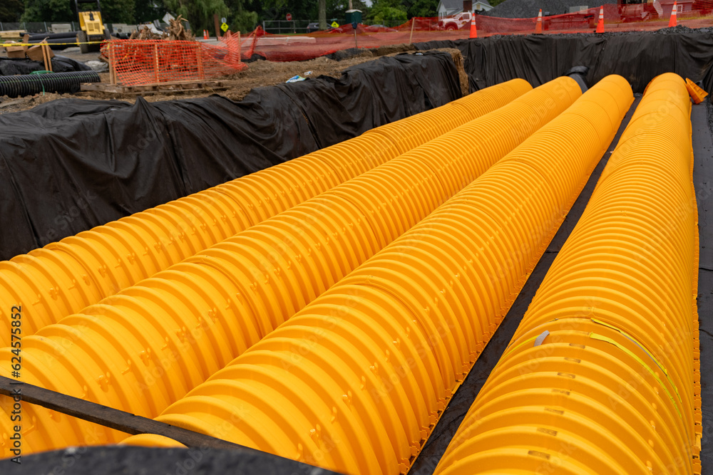Yellow underground storm water detention mitigation units on a ...