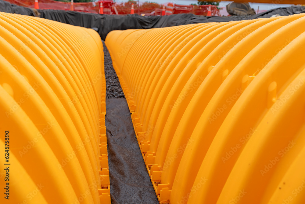 Yellow underground storm water detention mitigation units on a ...