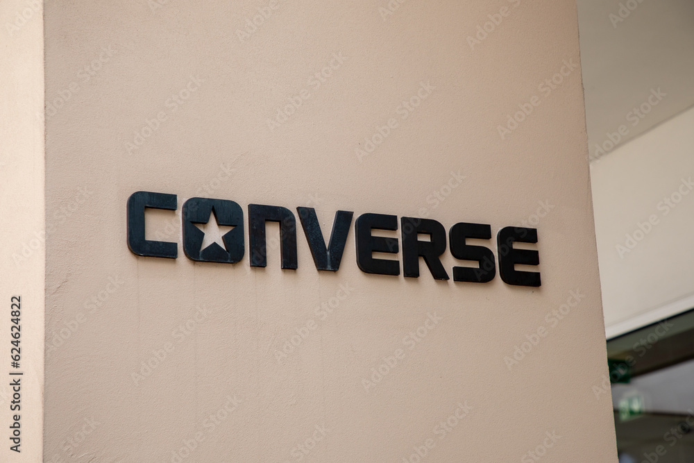 converse all star text brand and logo sign on wall facade store ...