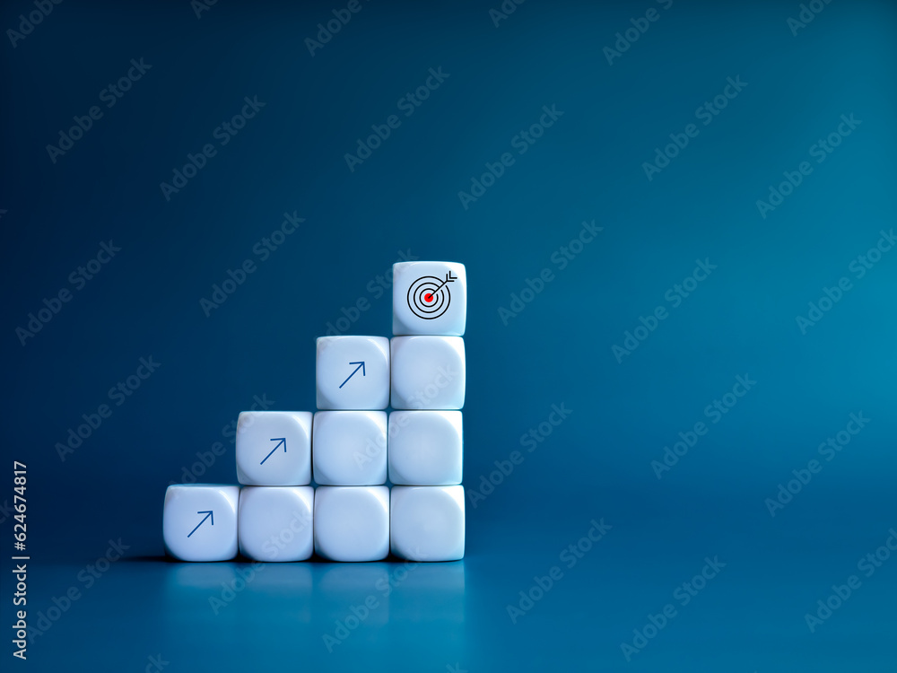 Goal target icon and arrows on white blocks business chart steps on ...