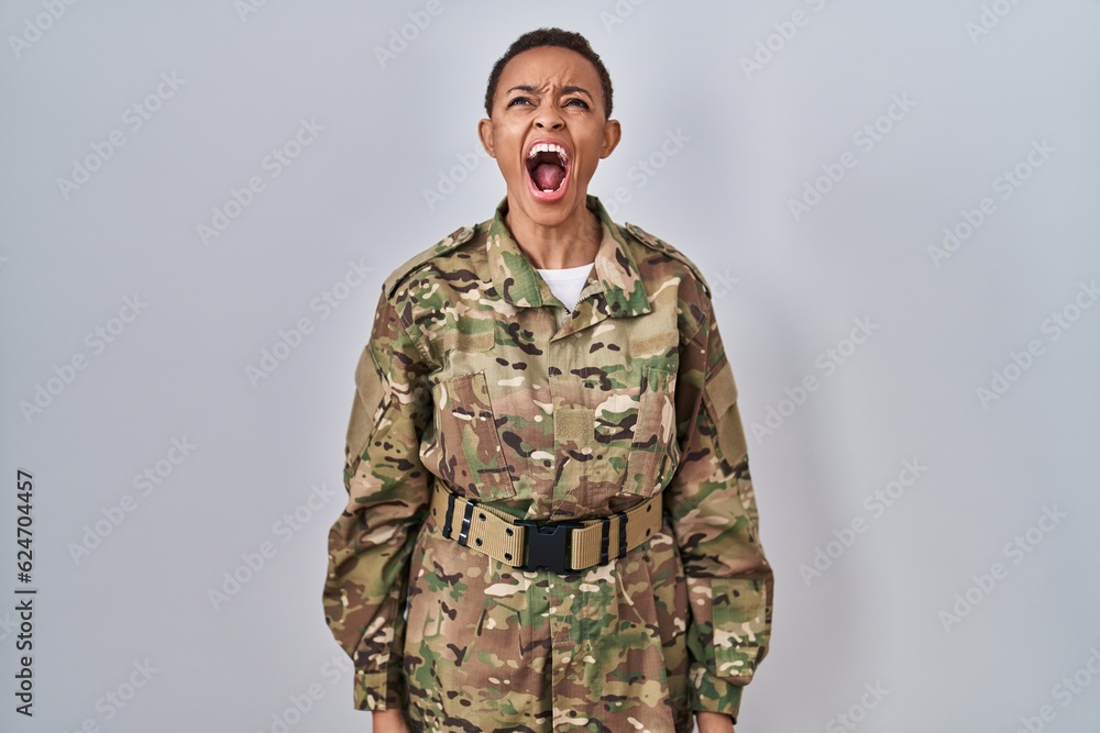 Beautiful african american woman wearing camouflage army uniform angry ...