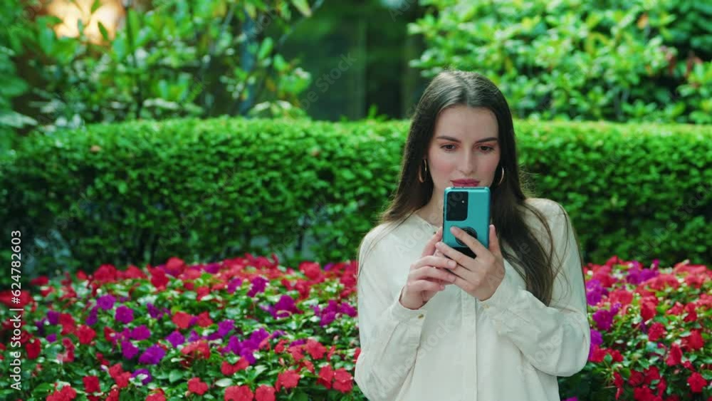 extraordinary beautiful woman looking in the phone and gets surprised ...