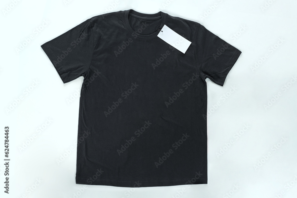 Black t-shirt laying on the table, top view, full body with a blank ...