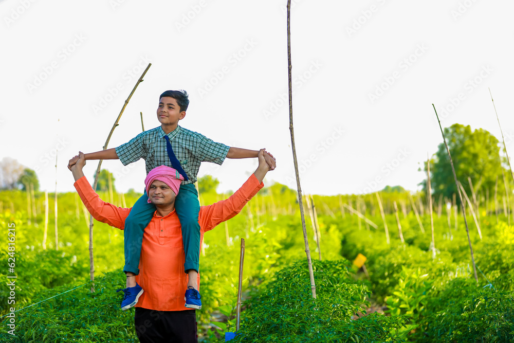 Cute indian farmer child in school uniform with his father at ...