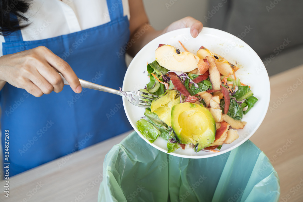 Food waste environment concept, people throwing food garbage into bin ...