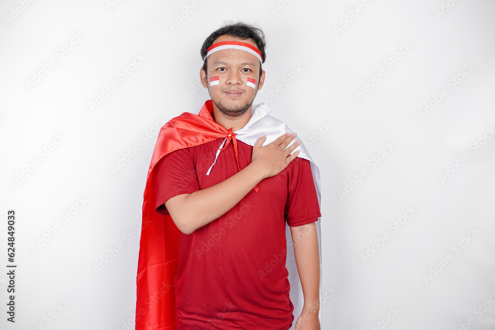 Indonesian man give salute with proud gesture while holding Indonesia's ...