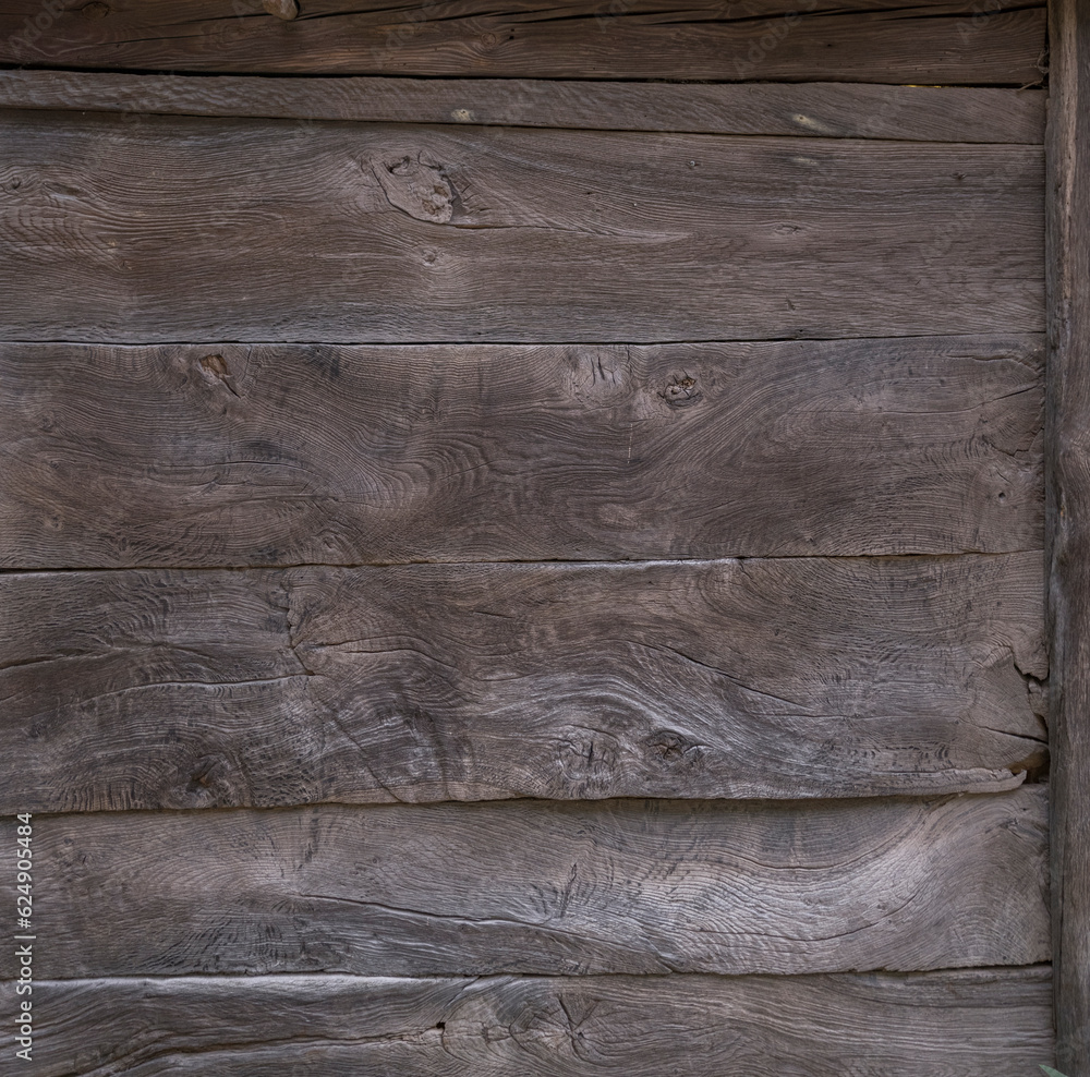 Old wood wall from a 1700s house in a park, a sunny summer day in ...