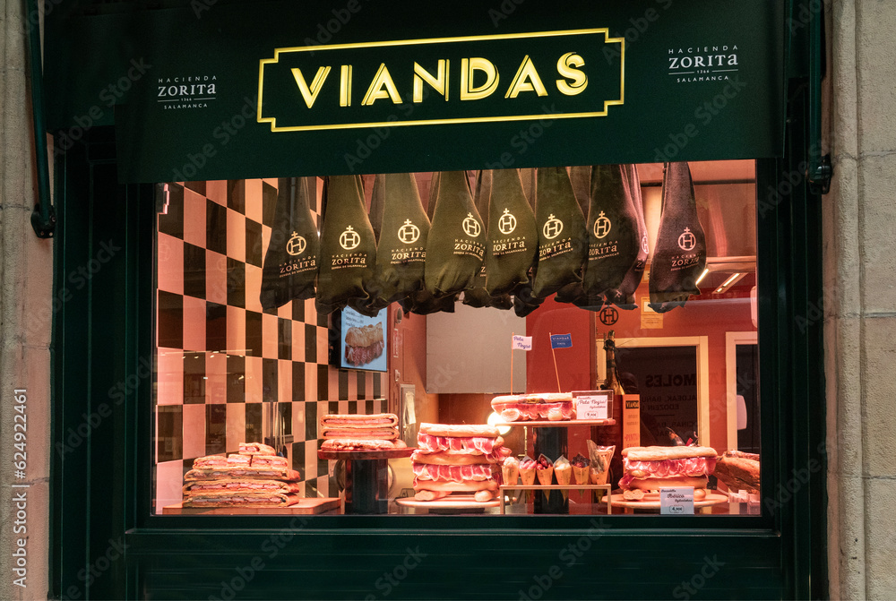 Window and facade of an elegant charcuterie and butcher shop display ...