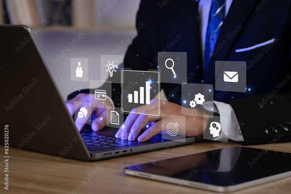 Person working on computer with icons of planning schedule. budget ...