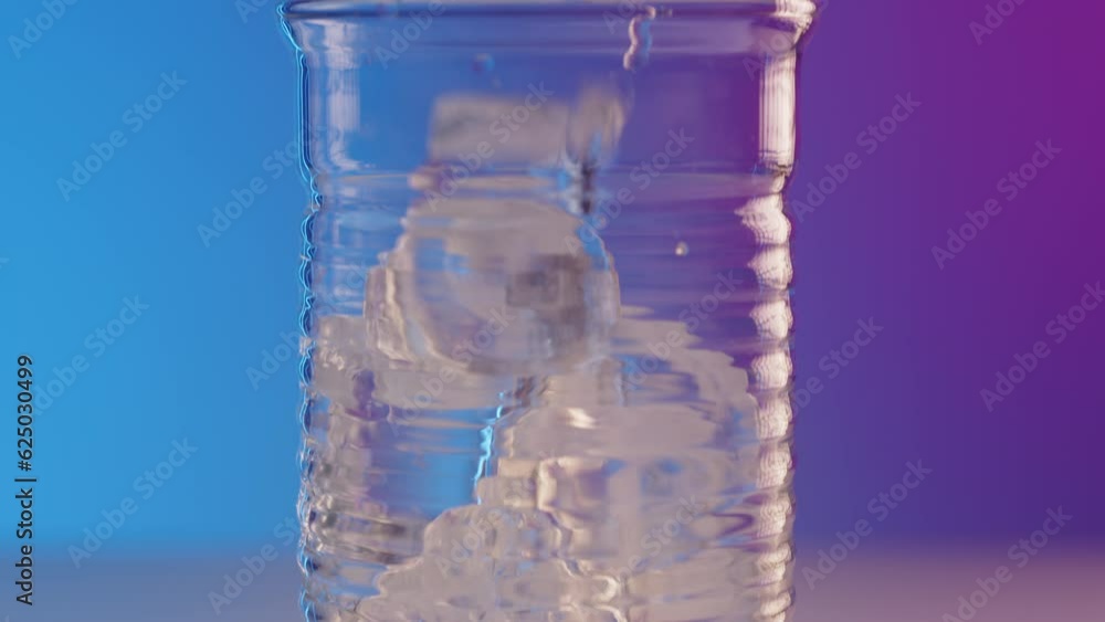 Pano shot bartender pours ice cubes from shaker into a beautiful narrow ...
