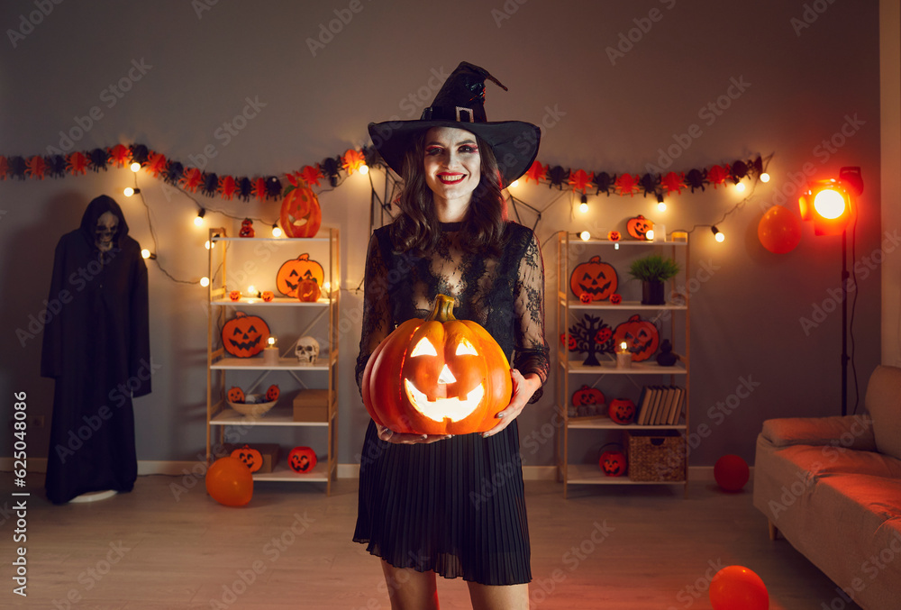 Woman at Halloween horror costume party. Portrait of happy pretty young ...