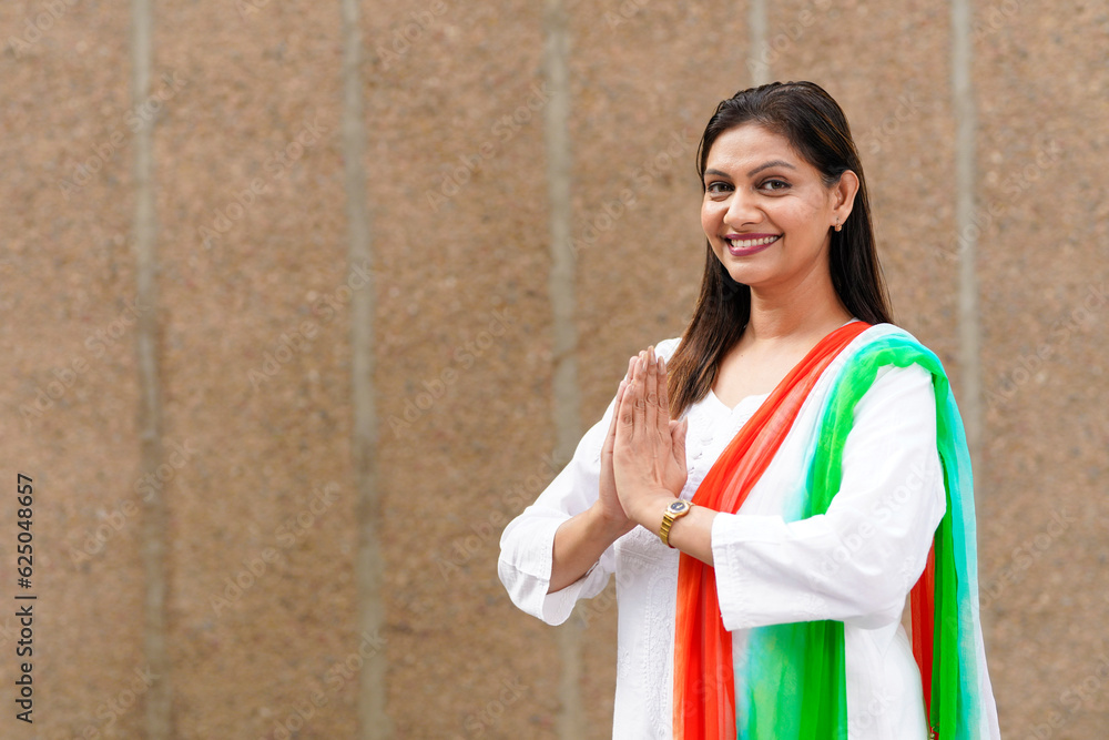 Indian woman giving namaste or welcome gesture. Stock Photo | Adobe Stock