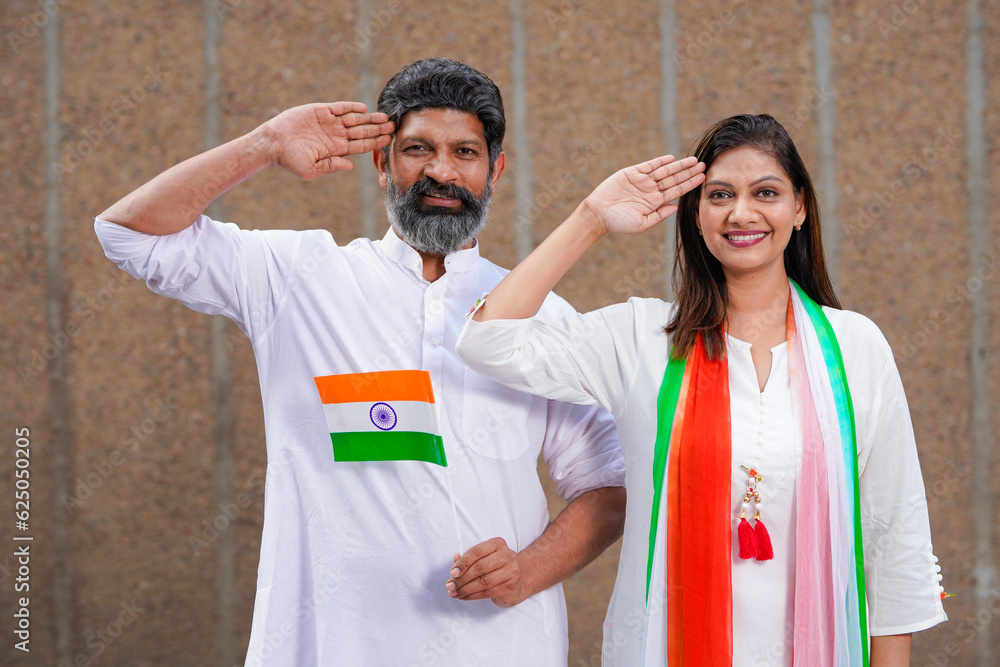 Indian couple saluting together and celebrating national festival ...