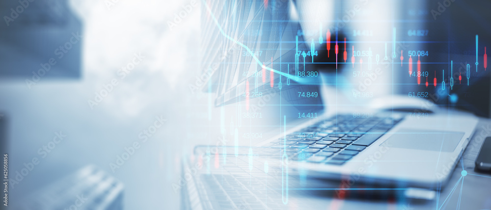 Wide image of office workplace with laptop and forex diagram on ...