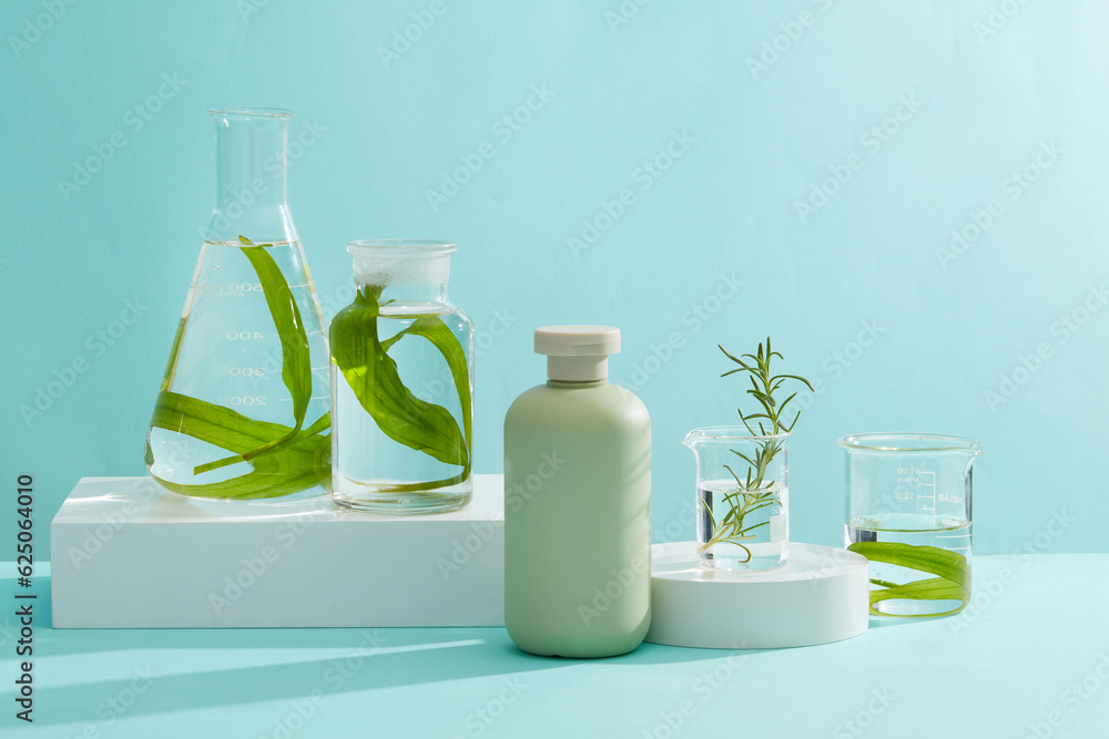 Pastel bottle without label decorated with two beakers, a jar and a ...