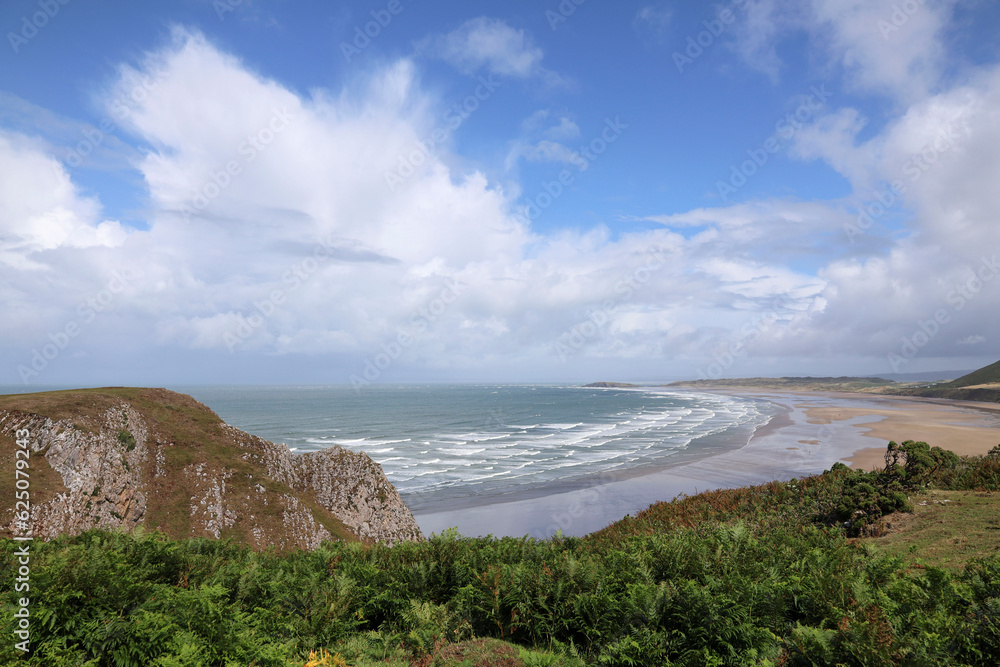 Rhossili Bay lies at the western end of the beautiful Gower peninsula ...