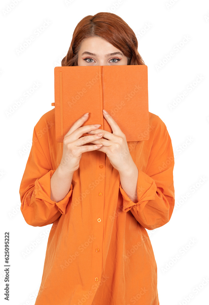 Student girl hides behind book, portrait of young red hair student girl ...