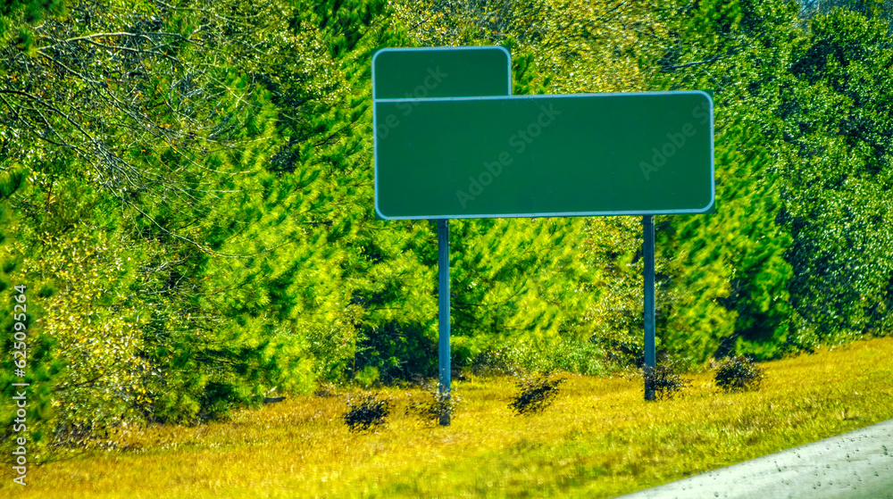 Empty interstate road sign on the left side of the road Stock Photo ...