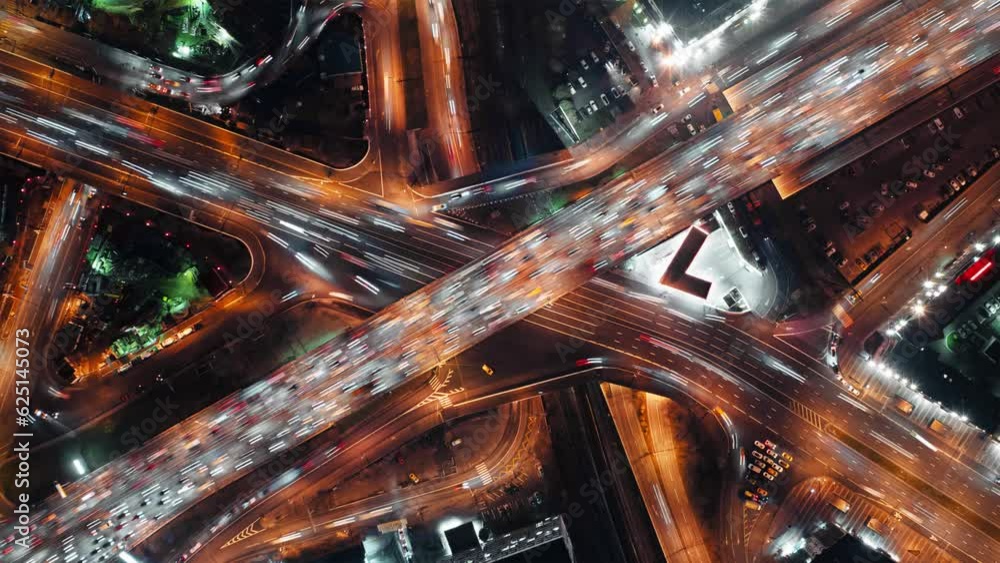 Top-down time-lapse view of fast-moving cars on a highway, intense ...