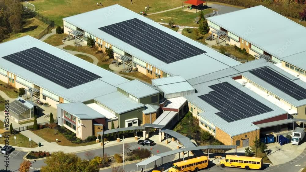 Roof of american school building covered with photovoltaic solar panels ...