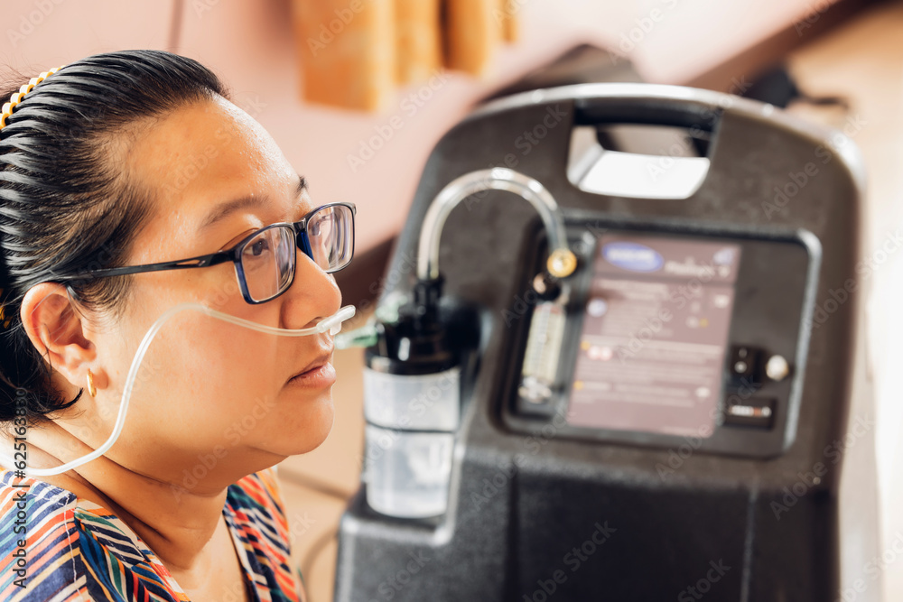 Patients woman wear oxygen inhaler device for helping breath ...