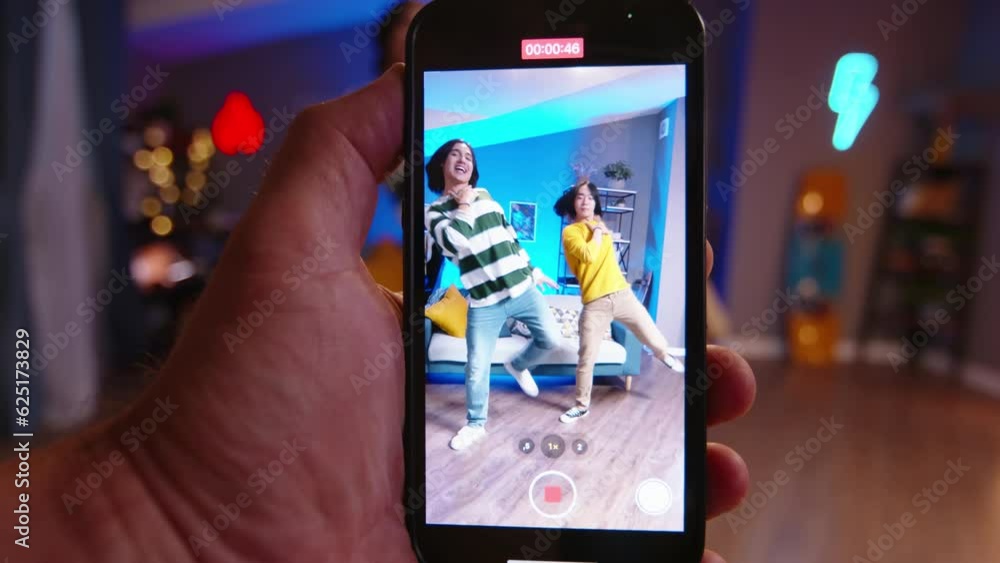 Teenagers recording K-pop dance video. Teenagers dance to Korean music ...