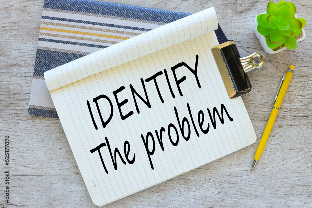 identify the problem, open notebook with text. notepad on work desk ...