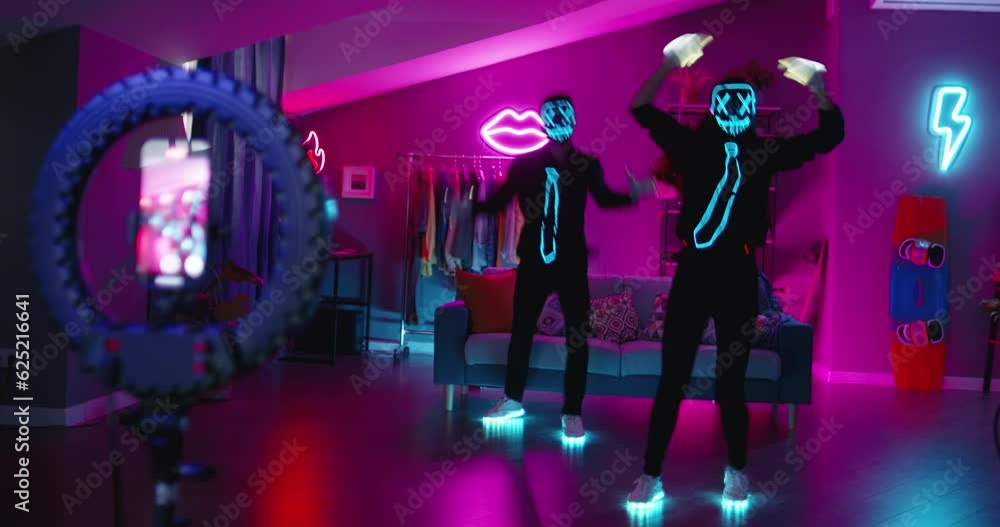 Two dancers record trending reels for social media channel. In ...