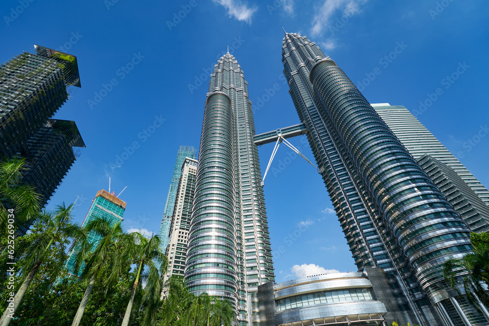 KUALA LUMPUR, MALAYSIA - MAY 29, 2023: street level view of Petronas ...