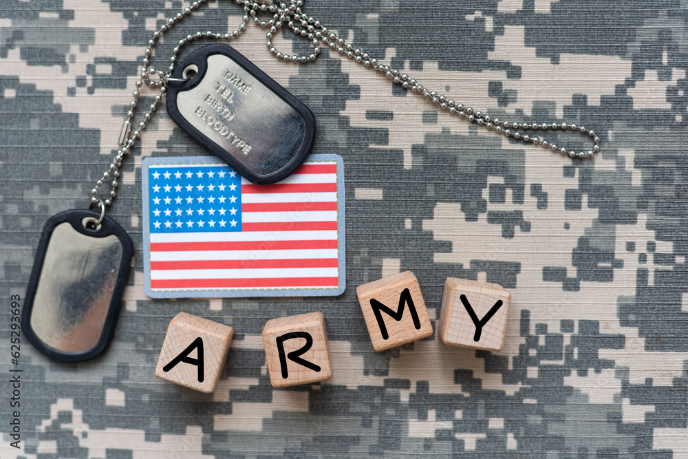 Military ID tags and US army patches on camouflage background, flat lay ...