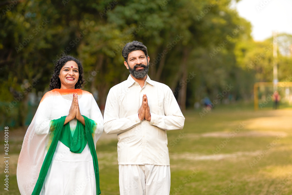 Indian couple in traditional wear and giving namaste gesture. Stock ...
