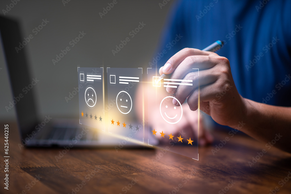 Customer rating and satisfaction concept, Man using laptop and tick a ...