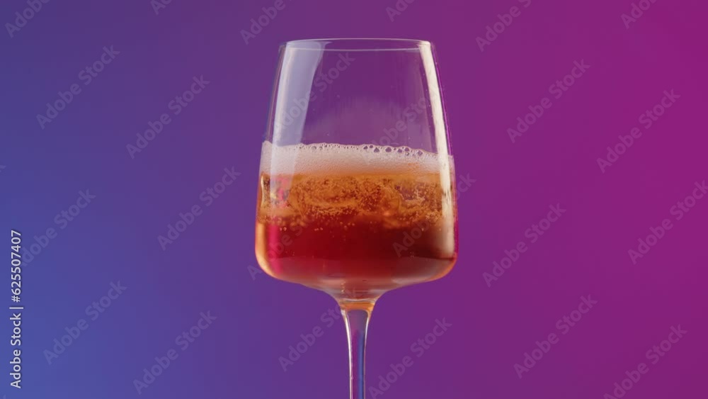 Hand of a professional bartender pours prosecco from bottle into long ...