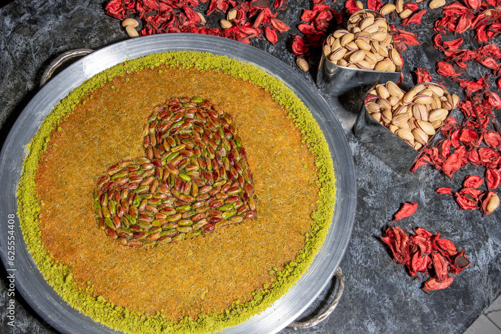 Kanafeh.Turkish dessert kunefe, kunafa, kadayif with pistachio powder ...