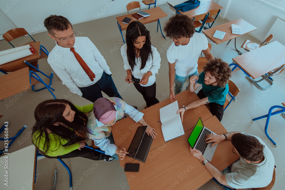 Top view photo of a diverse group of students gathers in a modern ...
