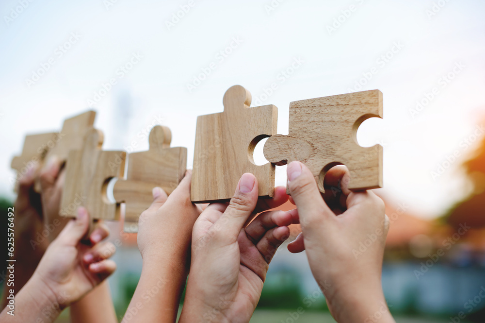 Jigsaw puzzle in hand, teamwork together communication puzzle piece ...