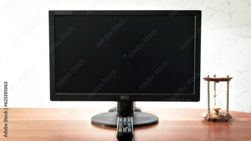 Work desk for digital job with computer, hourglass and remote control ...