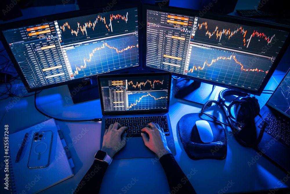 Money stock market display. Trader at work during night. Stock Photo ...