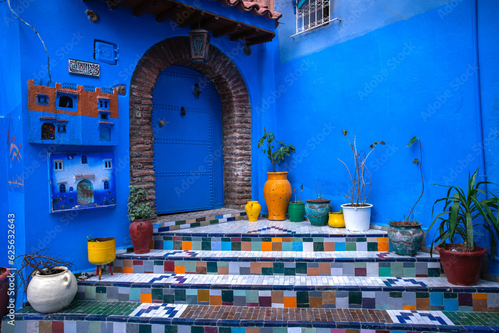 Blue shade of houses, street and alley in Chefchaouen, a city in ...